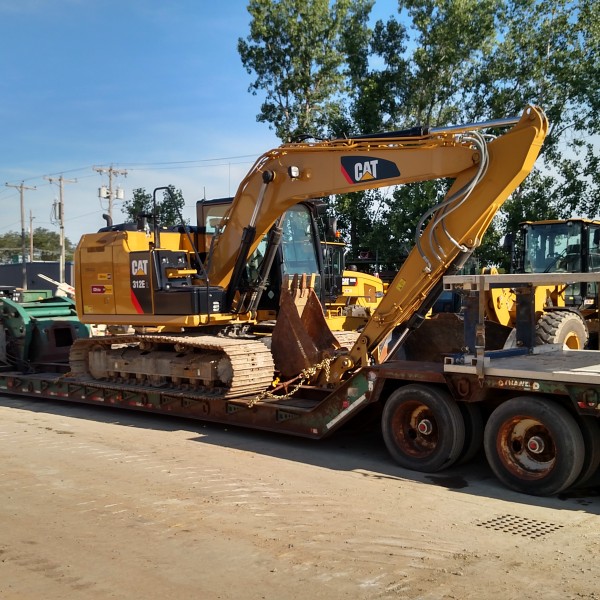 2015 PETERBILT WITH RGN TRAILER LOADED WITH A 312 CAT – Reliance Rental
